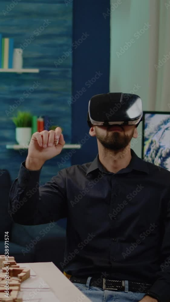 Vertical video: Modern architect using vr glasses for building model ...