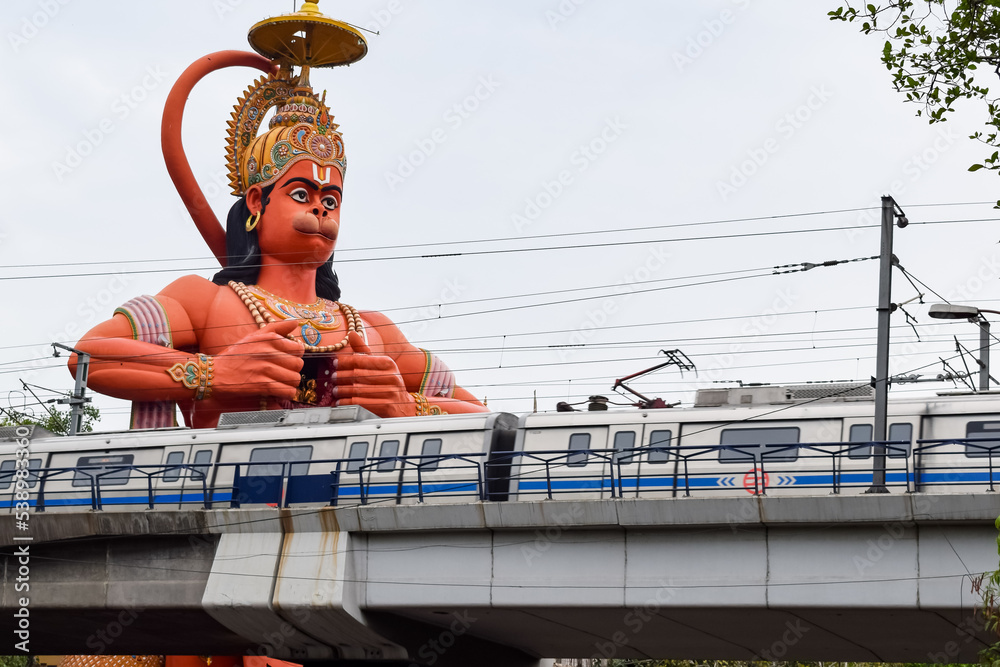 Big statue of Lord Hanuman near the delhi metro bridge situated near ...
