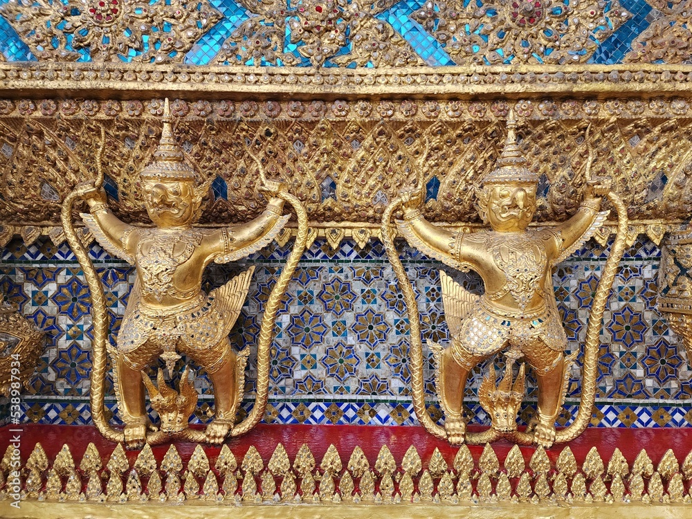 Garuda captures the Naga statue lined around the outer wall base Around ...