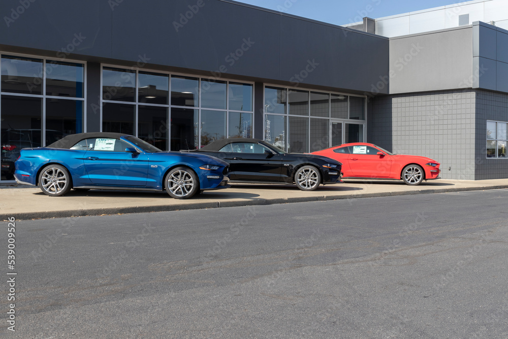 Ford Mustang display at a dealership. Mustangs can be ordered in a base ...