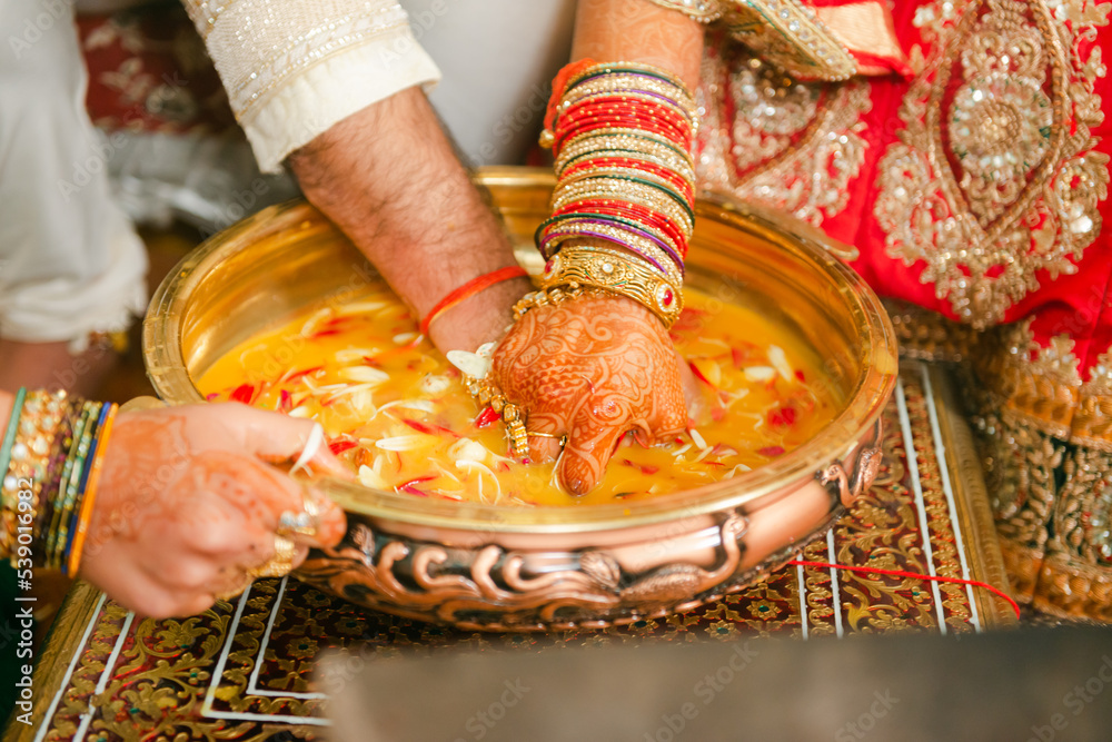 Bride and Groom playing find the ring game in south indian wedding ...