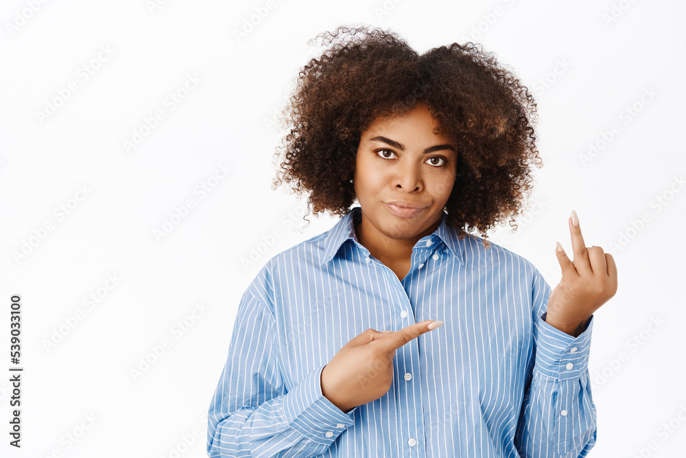 Annoyed african american woman shows her finger without wedding ring ...