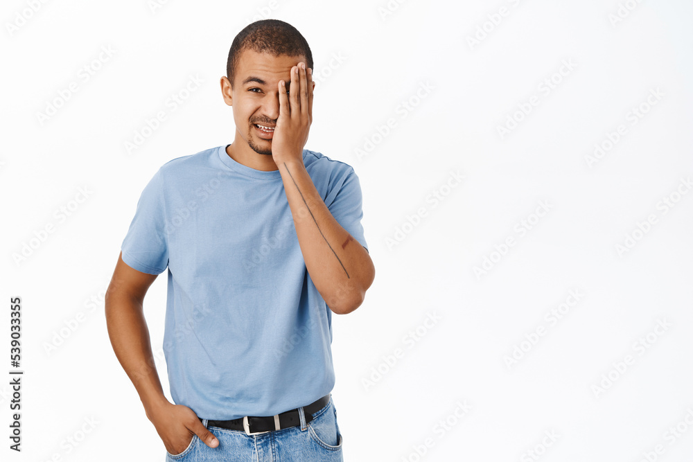 Image of guy facepalm, looking with pity and cringe at smth ...