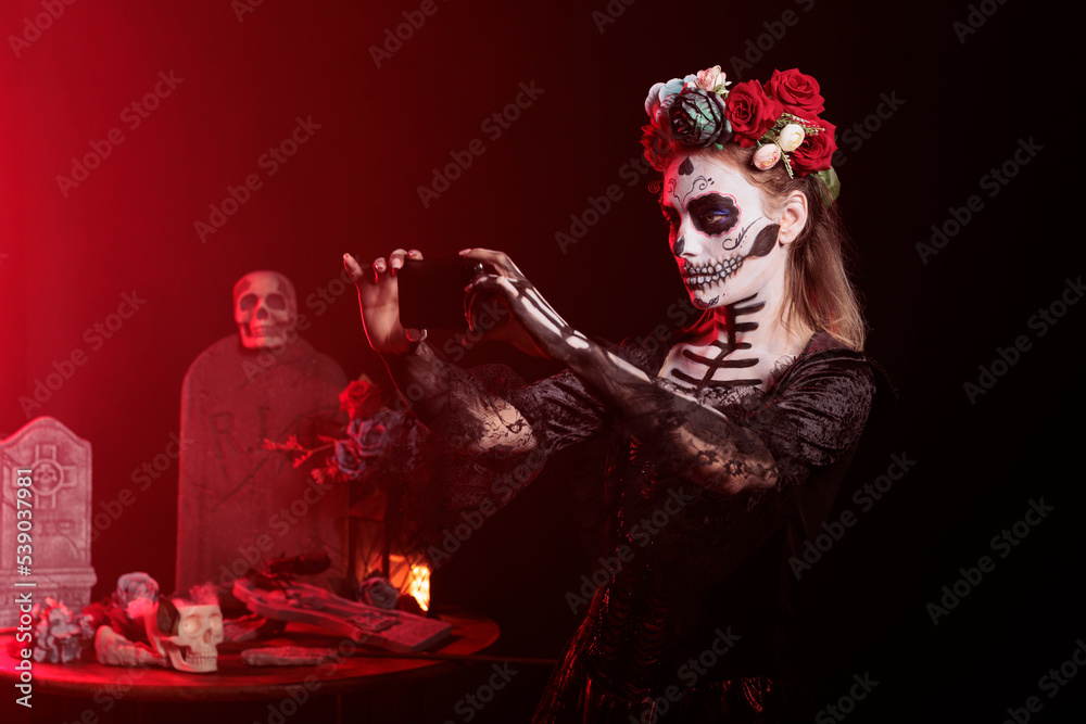 Spooky goddess of death taking photos on smartphone, capturing horror ...