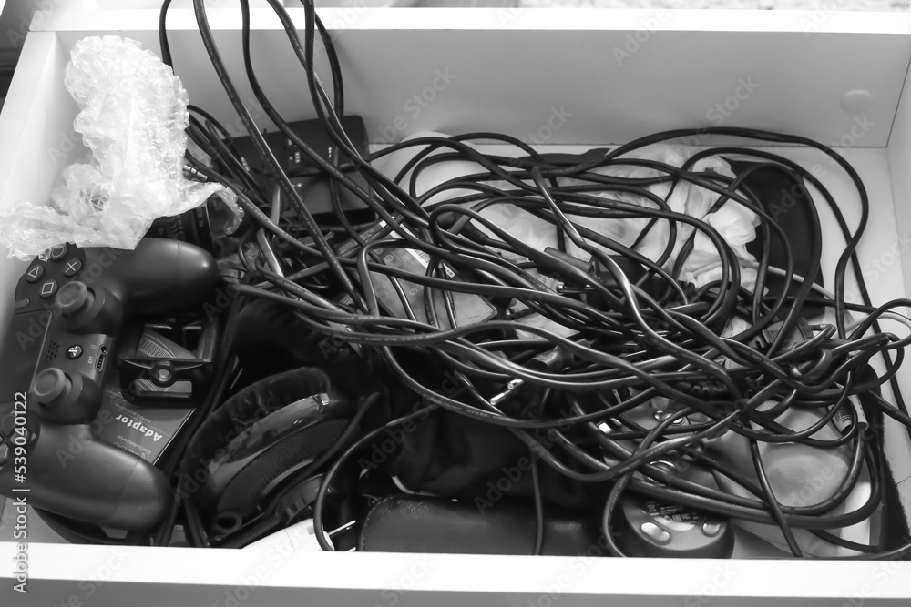 Ukraine, Mykolaiv - May, 2021: tangled wires in a box. Box with cables ...