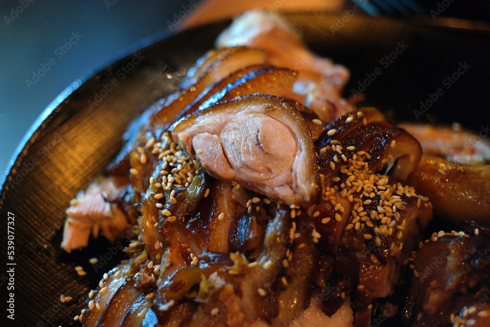 Korean food made with pork feet marinated in soy sauce and cut into ...