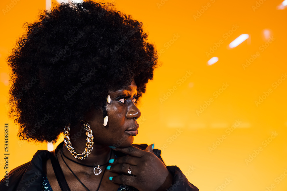 African woman's face with yellow light and traditional African hair ...