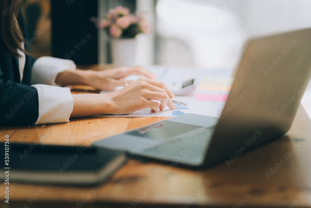 business woman or accountant who are using a calculator to calculate ...
