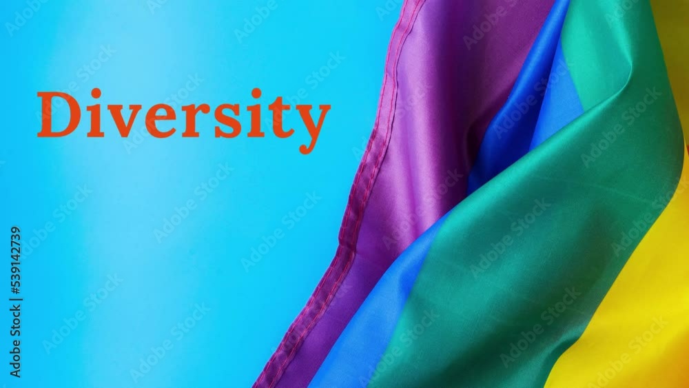 Video „4k zoom in out Rainbow flag with text DIVERSITY message. Rainbow ...