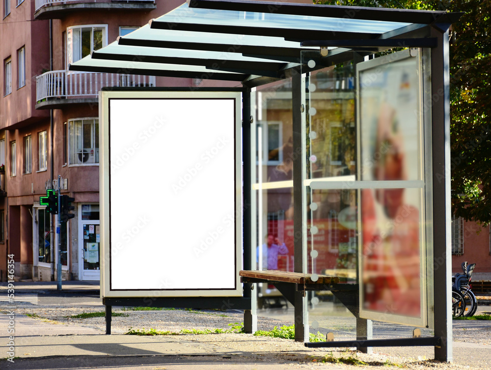 bus shelter at busstop. blank billboard ad display. empty white ...