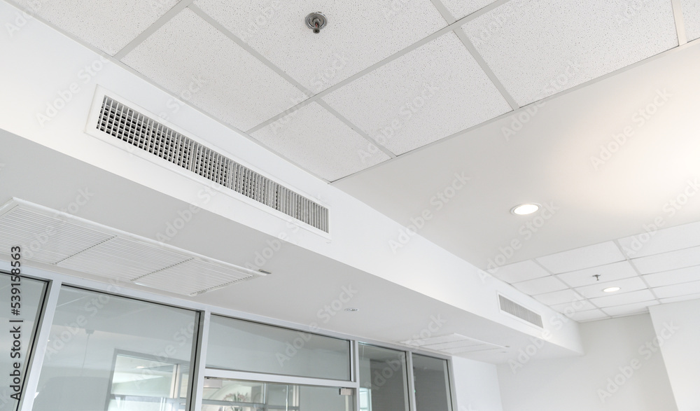 Ceiling mounted cassette type air conditioner and modern lamp light on ...