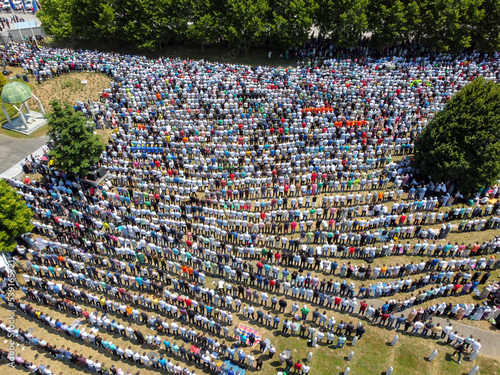 Muslim worshipers praying. Large crowd of Muslim people praying namaz ...