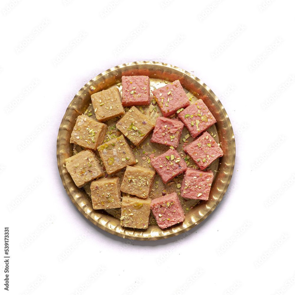 mix burfi or barfi in a plate top view - an indian traditional sweet or ...