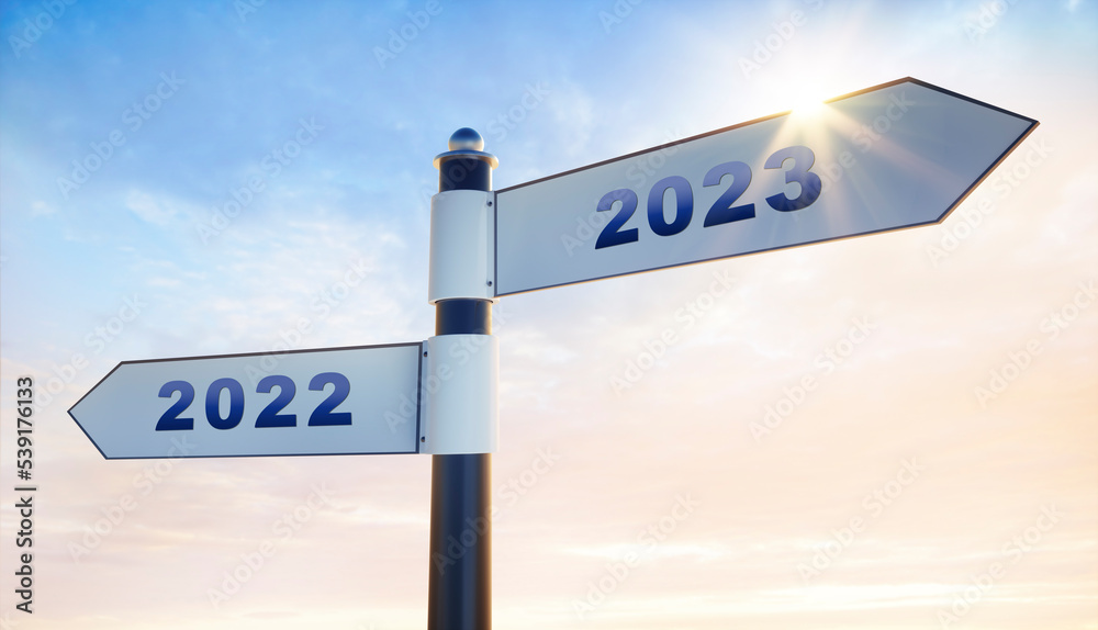 Road sign with the number s 2022 and 2023 against blue sunny evening ...