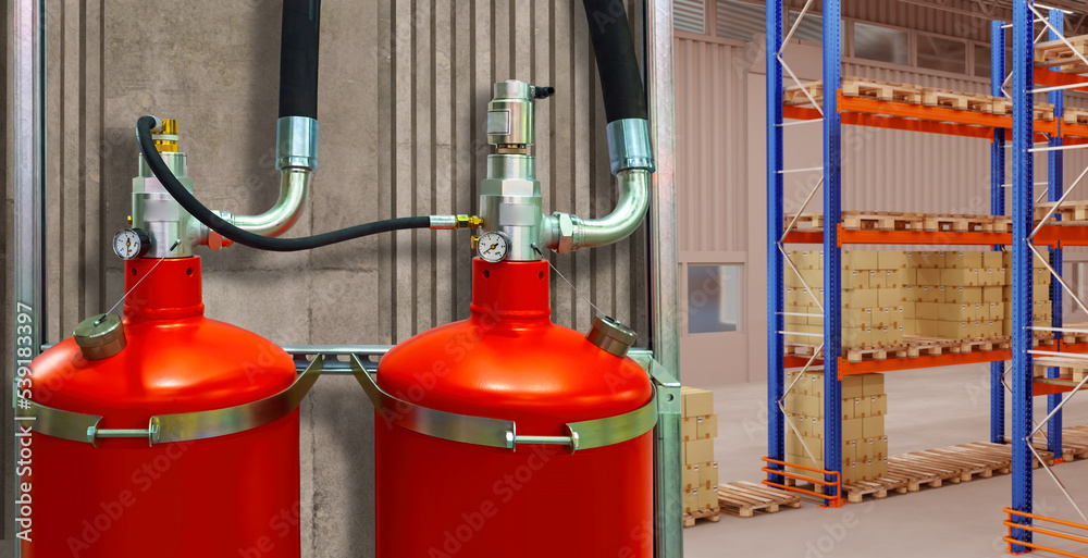 Warehouse fire extinguishing system. Red stationary fire extinguishers ...
