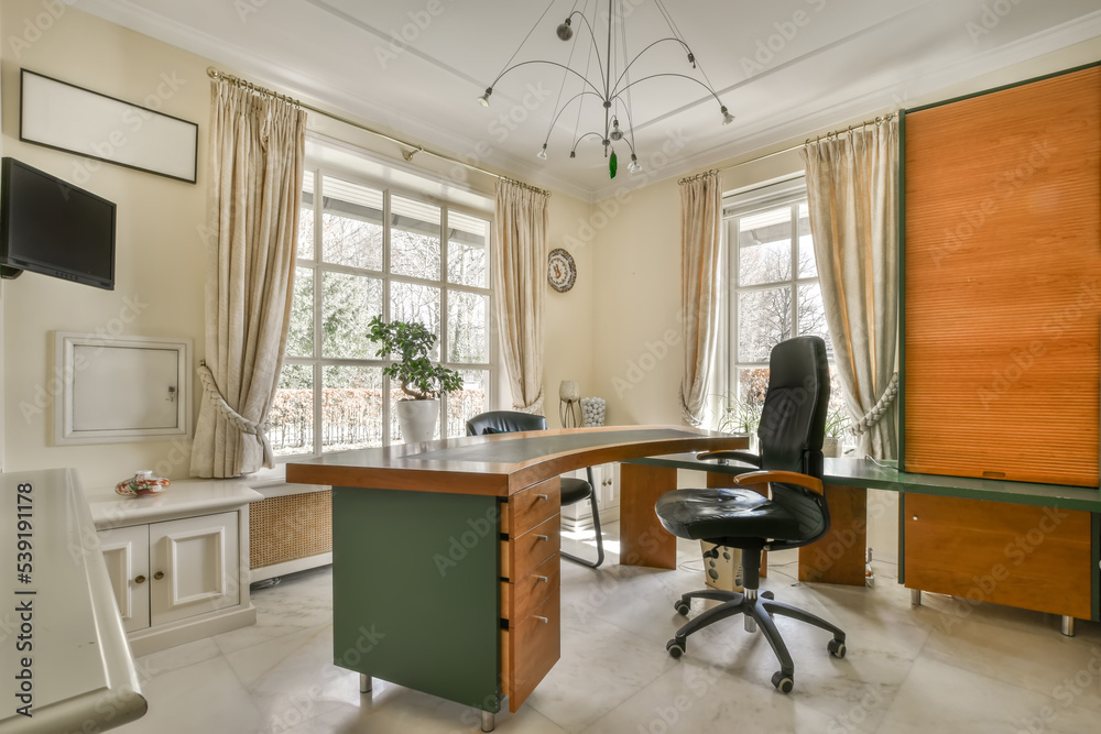 Interior of workplace in residential house with wooden desk and office ...