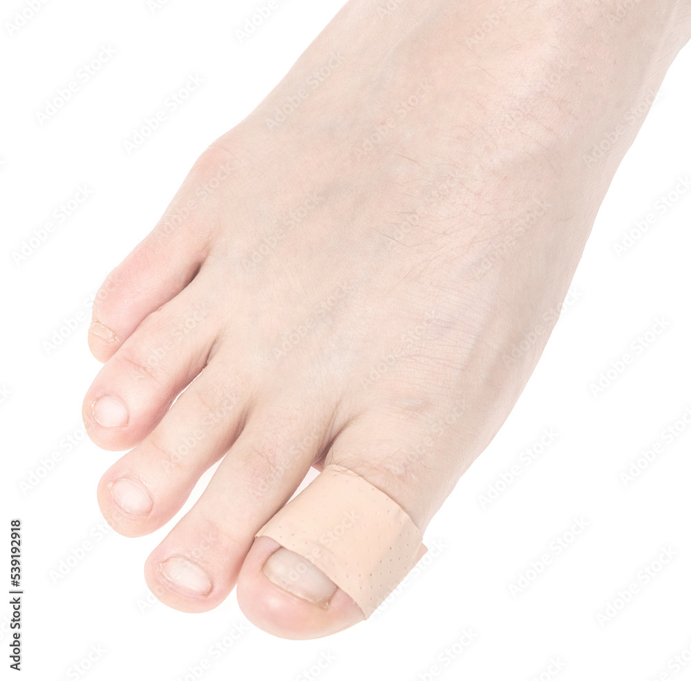 Human leg with medical adhesive wound plaster on toe isolated on white ...