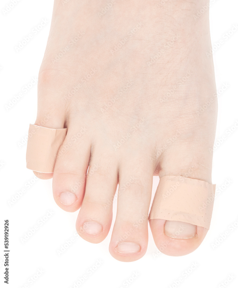 Human leg with medical adhesive wound plaster on toe isolated on white ...