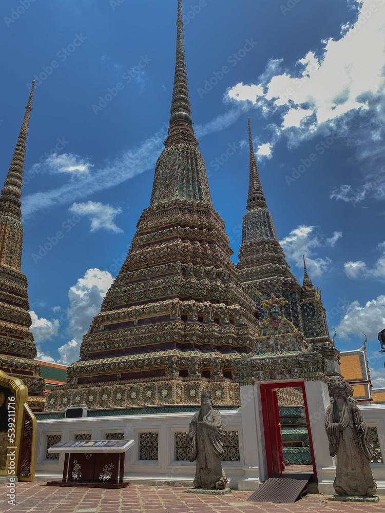 Wat Pho Temple in Bangkok, Thailand with stone pyramid towers, lying ...