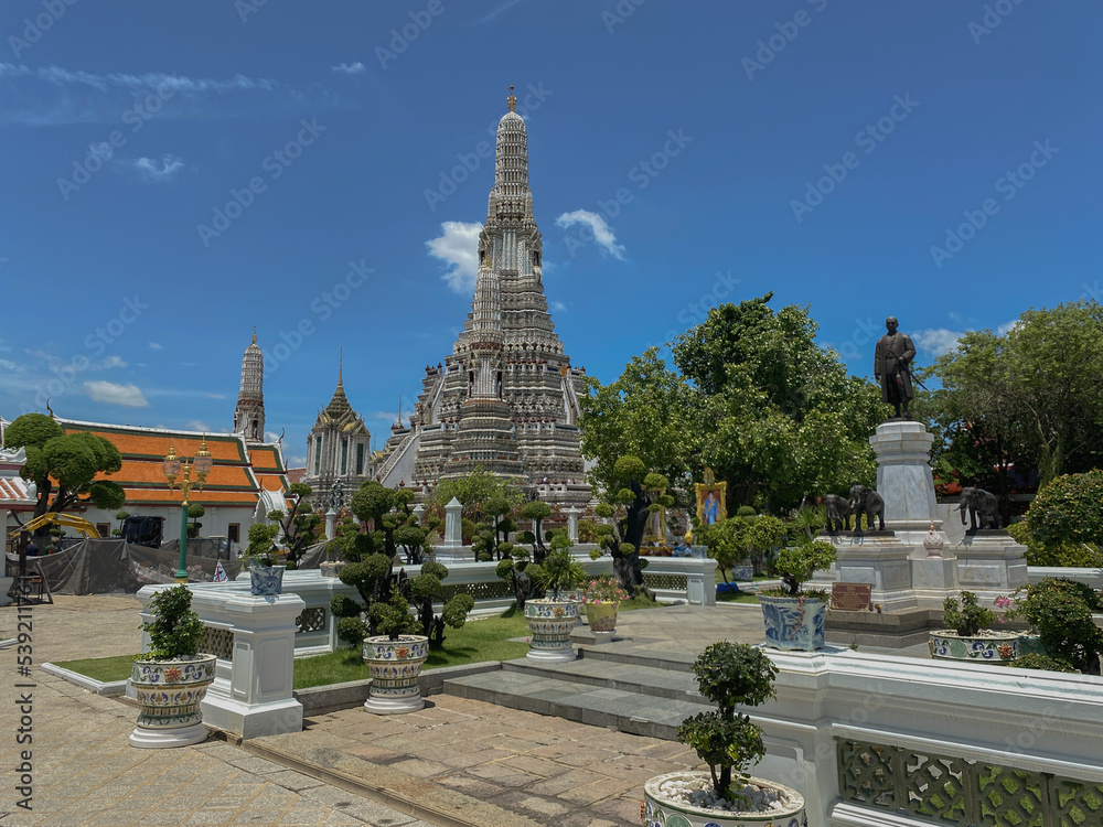 Wat Arun Temple in Bangkok, Thailand with stone pyramid towers, golden ...