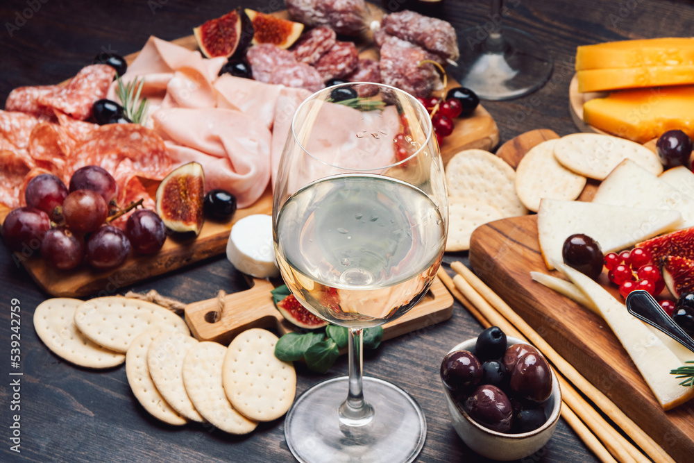 Food antipasto prosciutto ham, salami, olives and grissini bread sticks ...