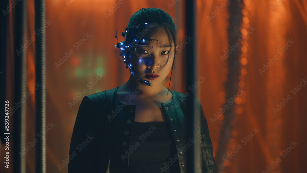 Cyberpunk girl in a black leather jacket trapped behind black hanging ...