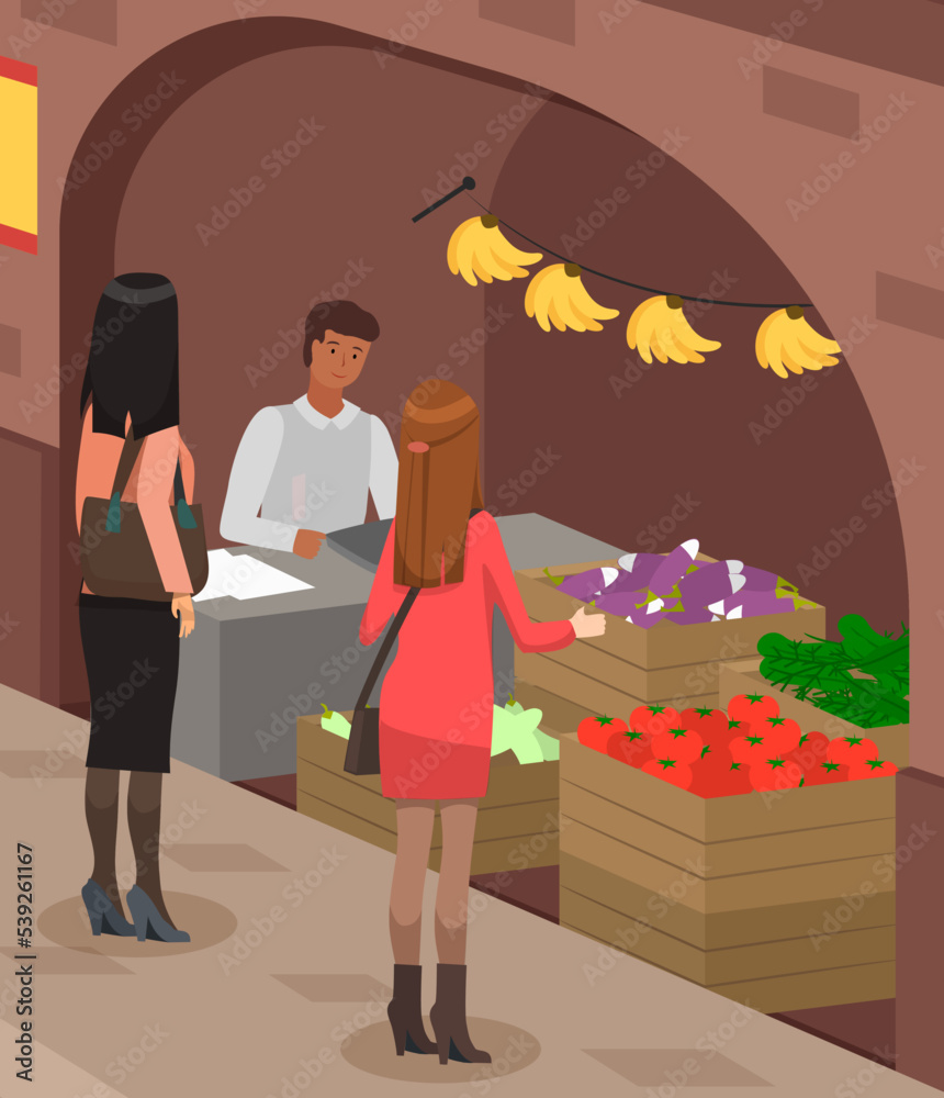 Tourists at eastern street bazaar, indian seller at counter sell ...