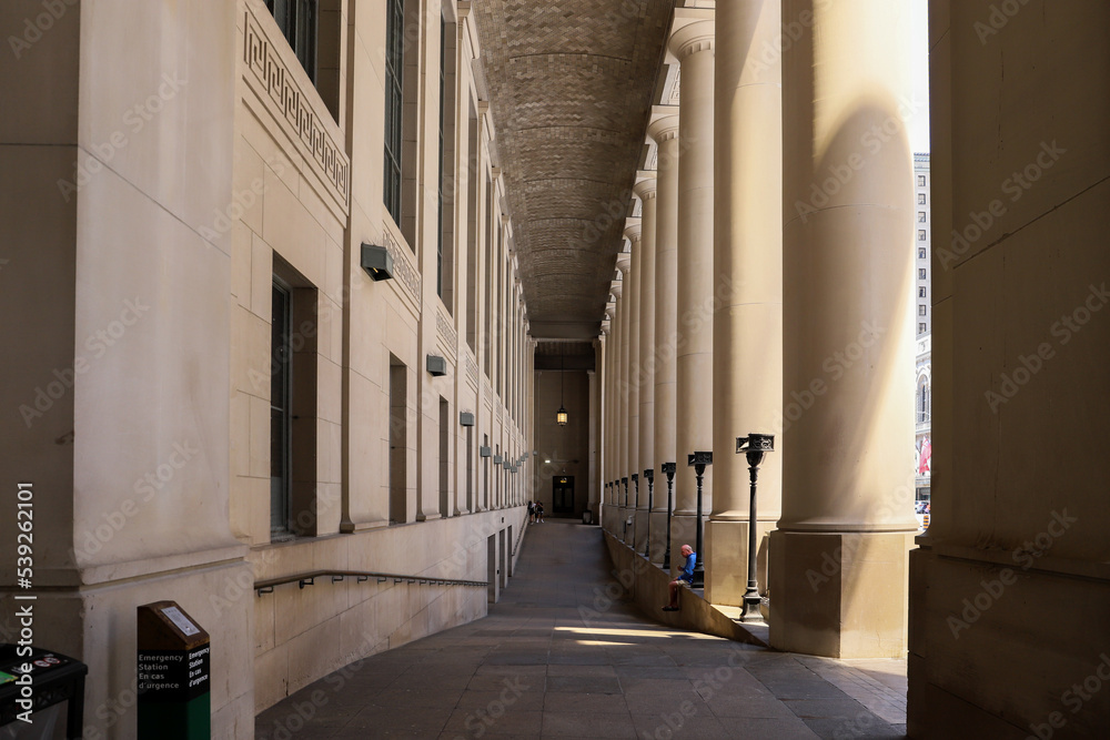 Old restored building - massive columns and a long corridor. Ancient ...