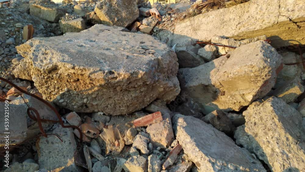 Rubble on the demolition site of a reinforced concrete building. Pile ...