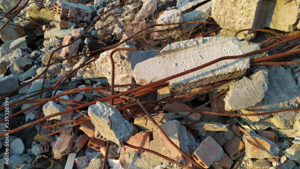 Rubble on the demolition site of a reinforced concrete building. Pile ...