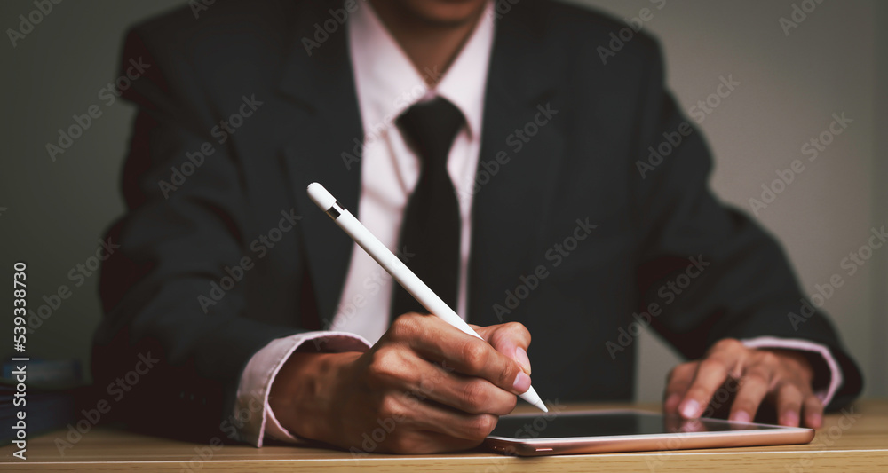 Businessman writes signing contract, designs, draws, or sketches ...