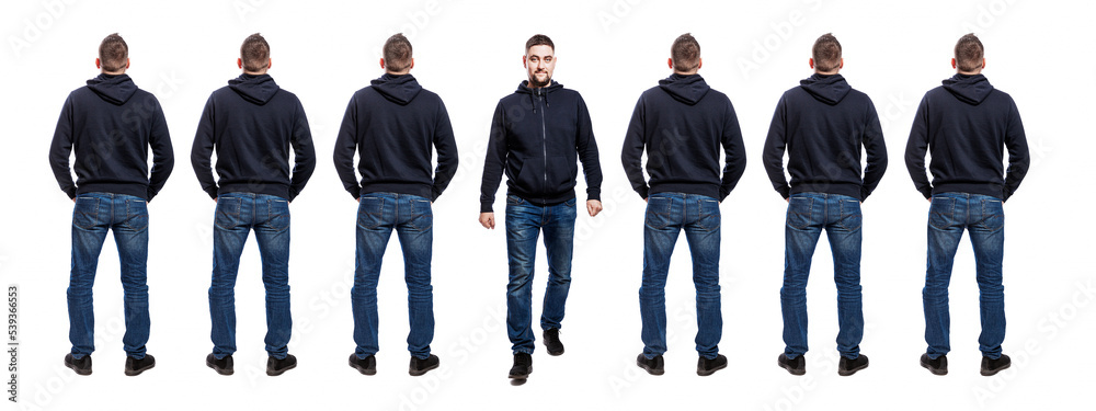 Lots of standing men in jeans and a blue hoodie. Back view. One ...