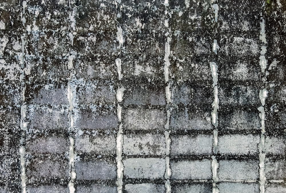 Dirty old eroded cracked plaster cement block fence. Concrete block ...