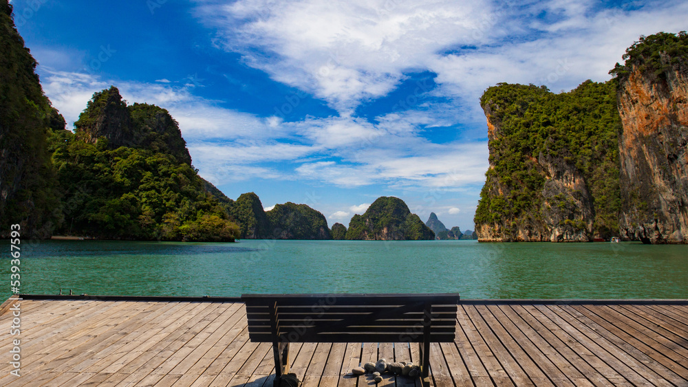 Thailand nature. Lakes in Phuket. Bench on wooden pier. Met with view ...