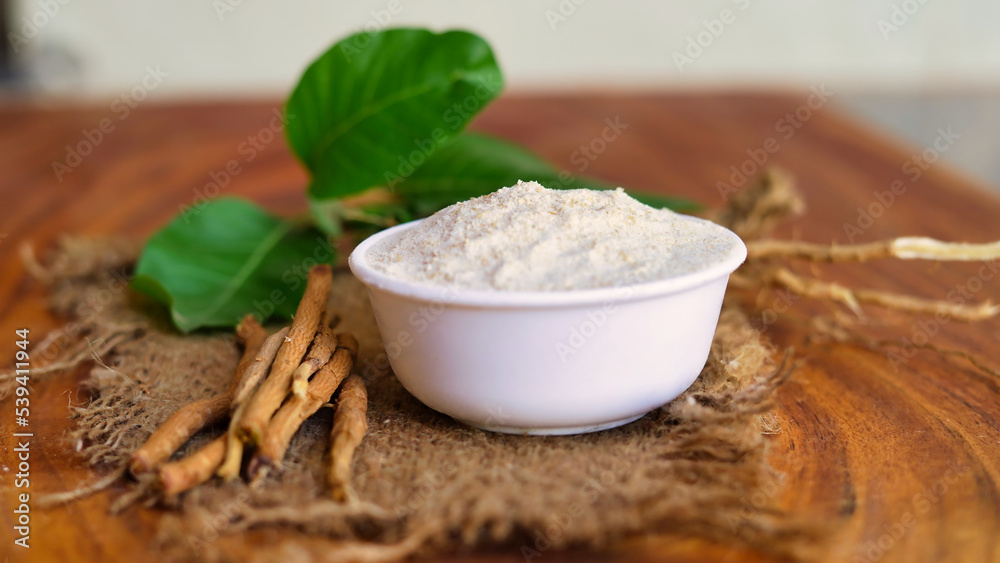 Roots and powder of Ashwagandha known as Withania somnifera in white ...