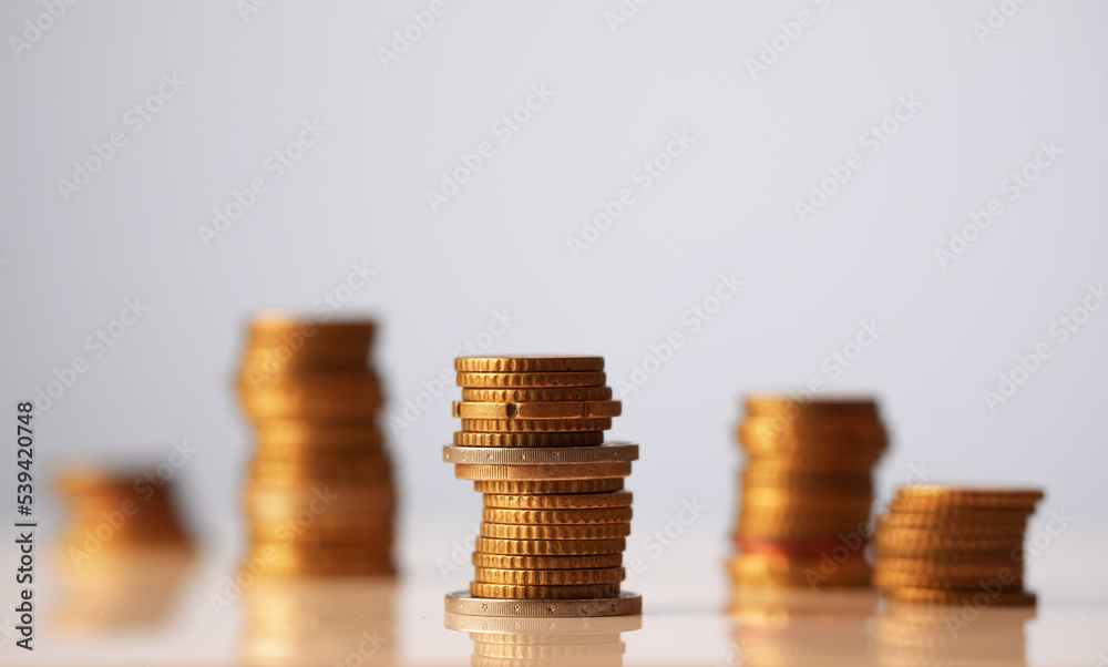Coin tower made of European currency against white grey background ...