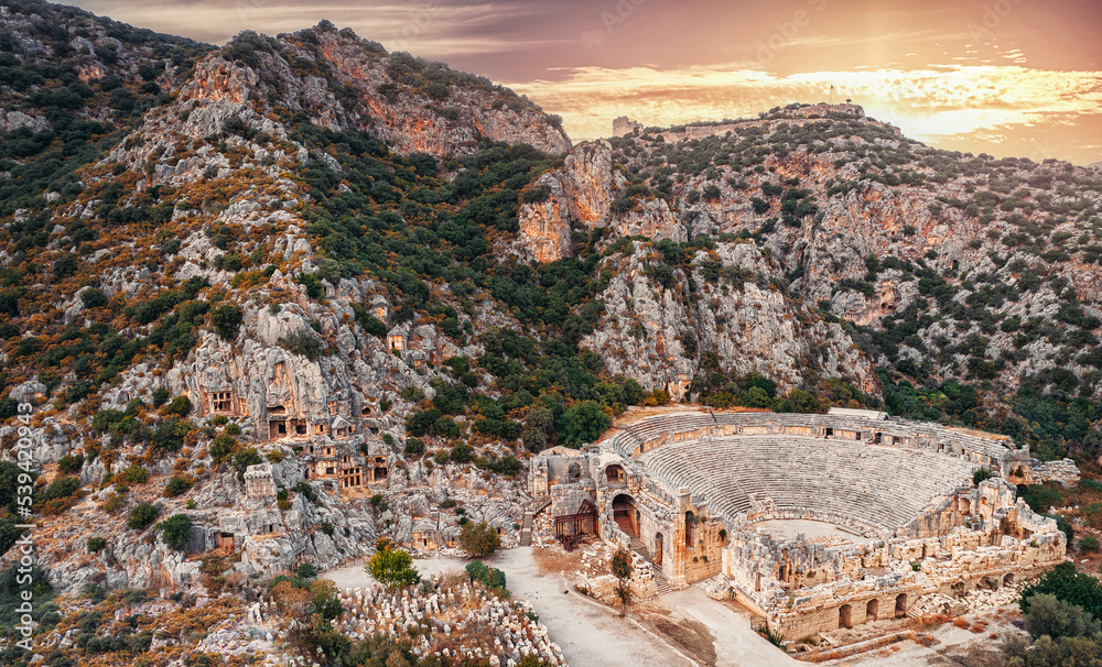 Ruins of ancient city Myra in Demre, Turkey Aerial Top view. Old tombs and amphitheater photo by ...