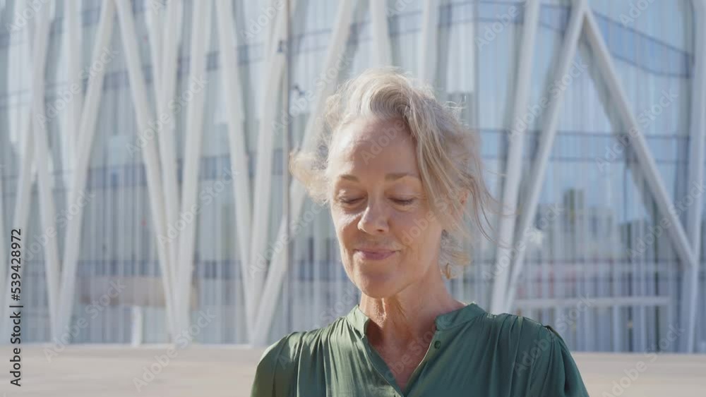 Cinematic footage of a beautiful senior fashion influencer with silver ...