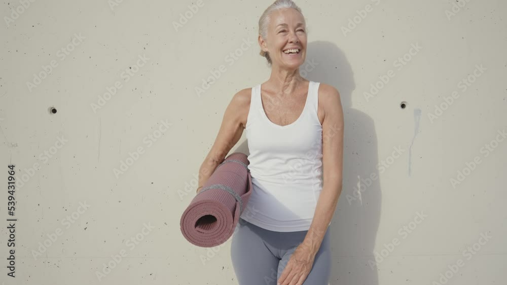 Cinematic footage of a beautiful senior fashion influencer with silver ...