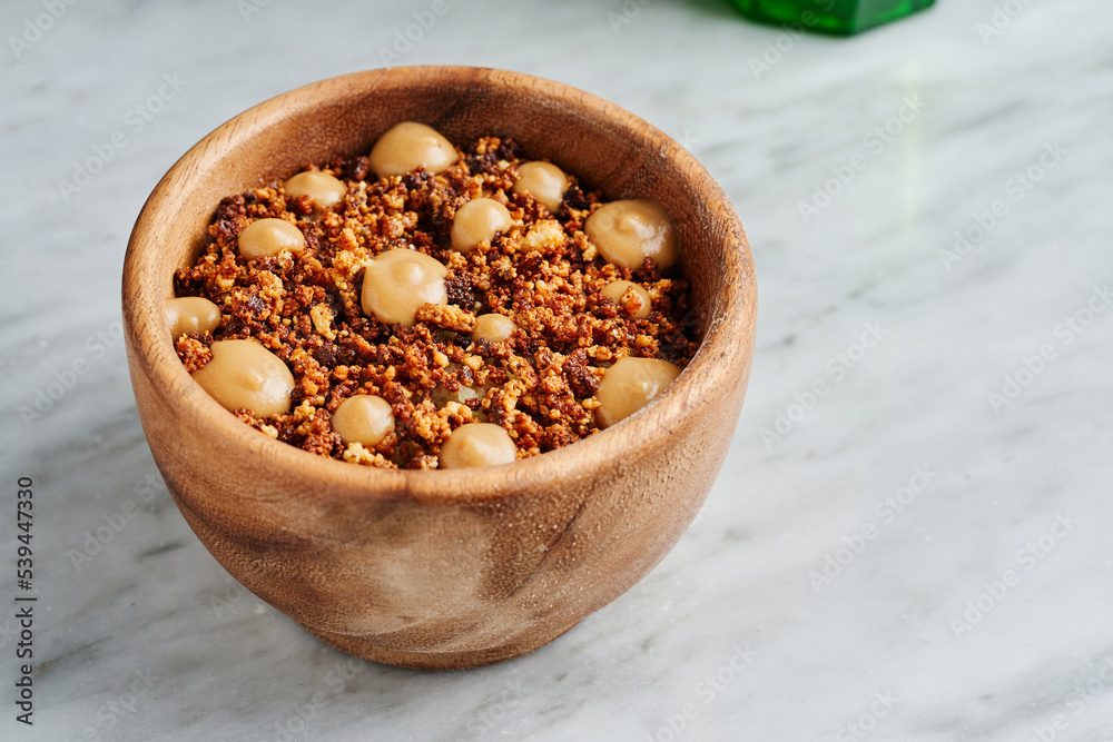 Fine dining plated main course dish of mashed potato, duck confit and ...