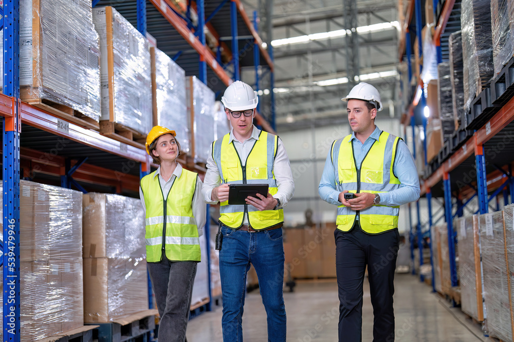 Worker in warehouse hold tablet check list perform inventory stock ...