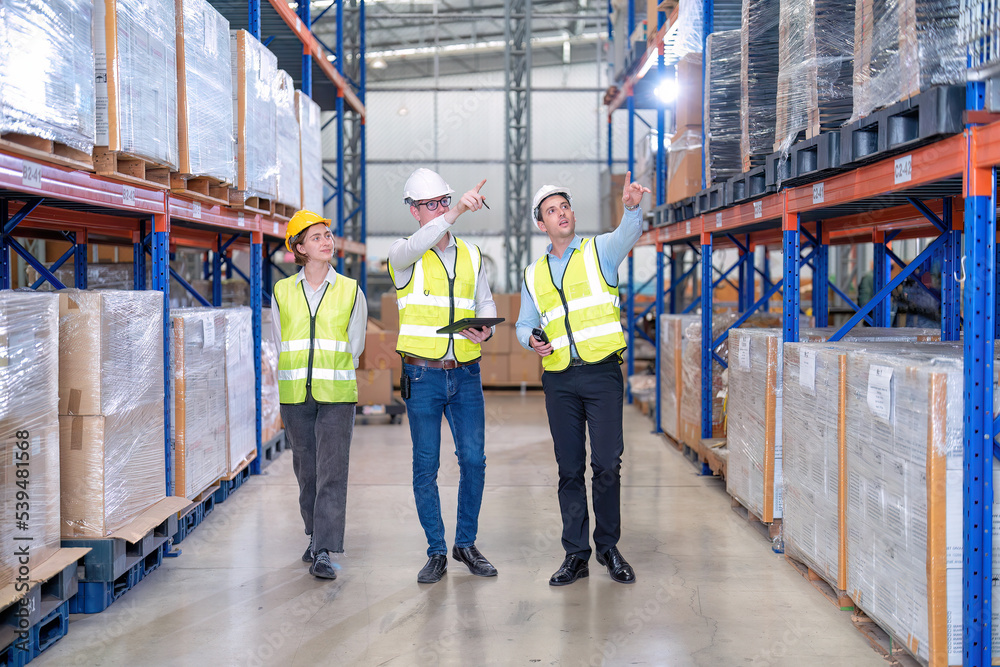 Worker in warehouse hold tablet check list perform inventory stock ...