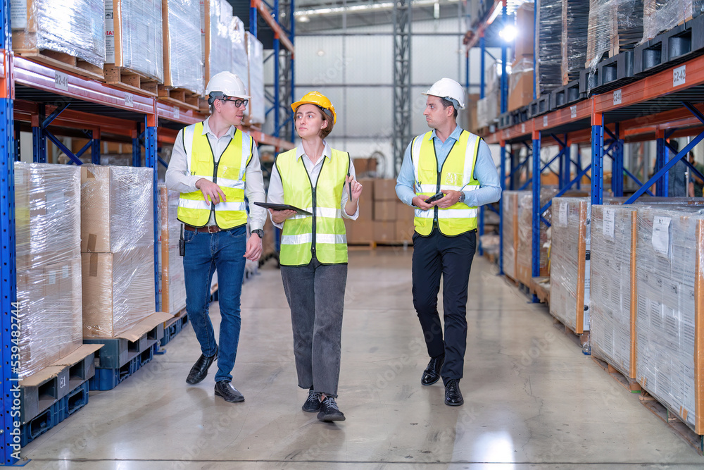 Worker in warehouse hold tablet check list perform inventory stock ...