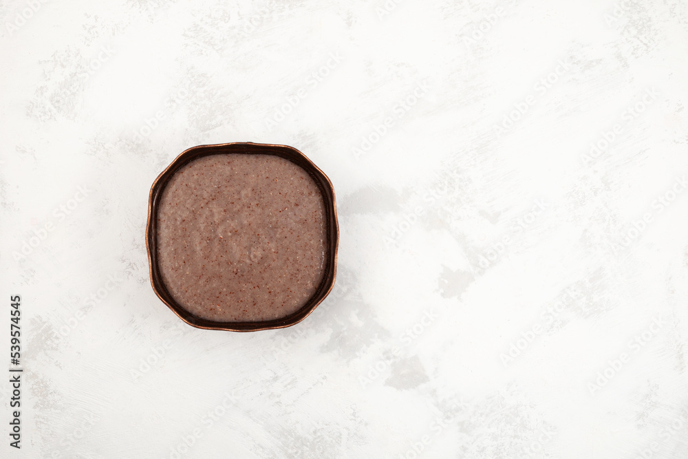 Ragi Porridge or Sweet Ragi Malt in metal bowl, top view. Healthy ...