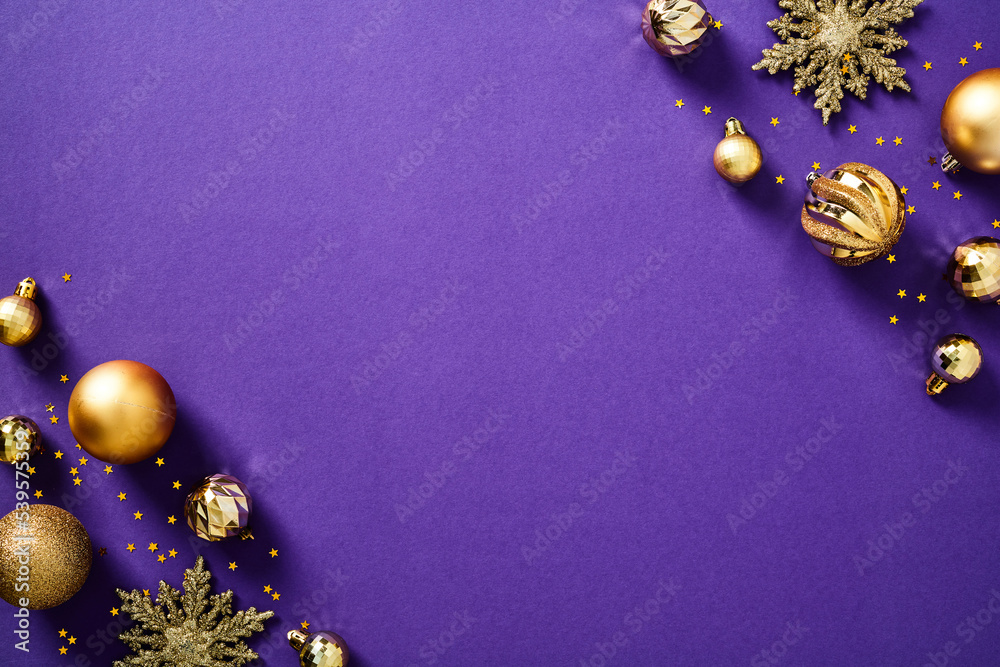 Purple Christmas background with golden balls and ornaments top view ...