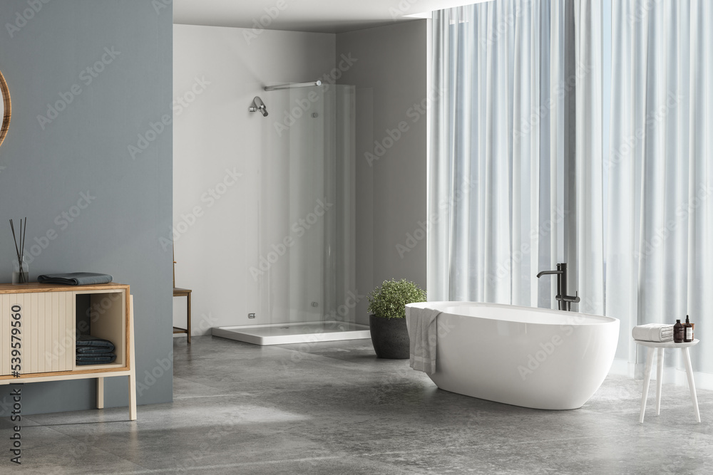 Modern bathroom interior with blue background, concrete flooring, white ...