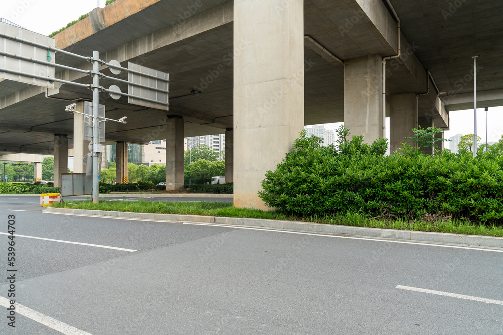 Concrete structure and asphalt road space under the overpass in the ...