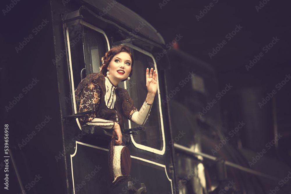 Beautiful girl in a historical retro dress on a background of an old ...