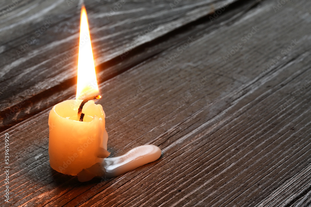One Lighting Candle Stock Photo | Adobe Stock