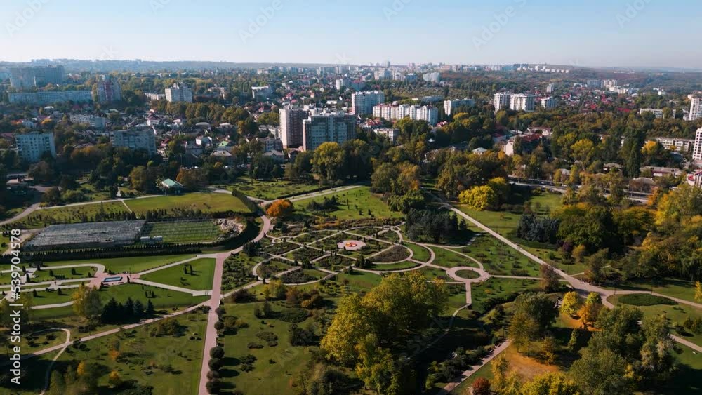 Ascending aerial drone flight over green Dendrarium Park in the capital ...